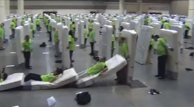 Watch: 850 People Break Human Mattress Domino Record | TIME.com
